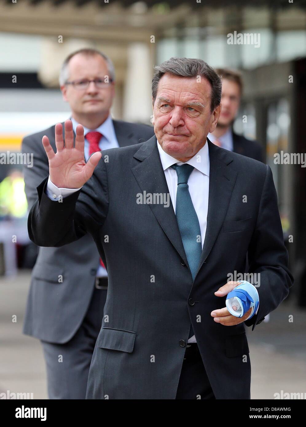 Former Chancellor Gerhard Schroeder leaves the ceremony to mark the ...