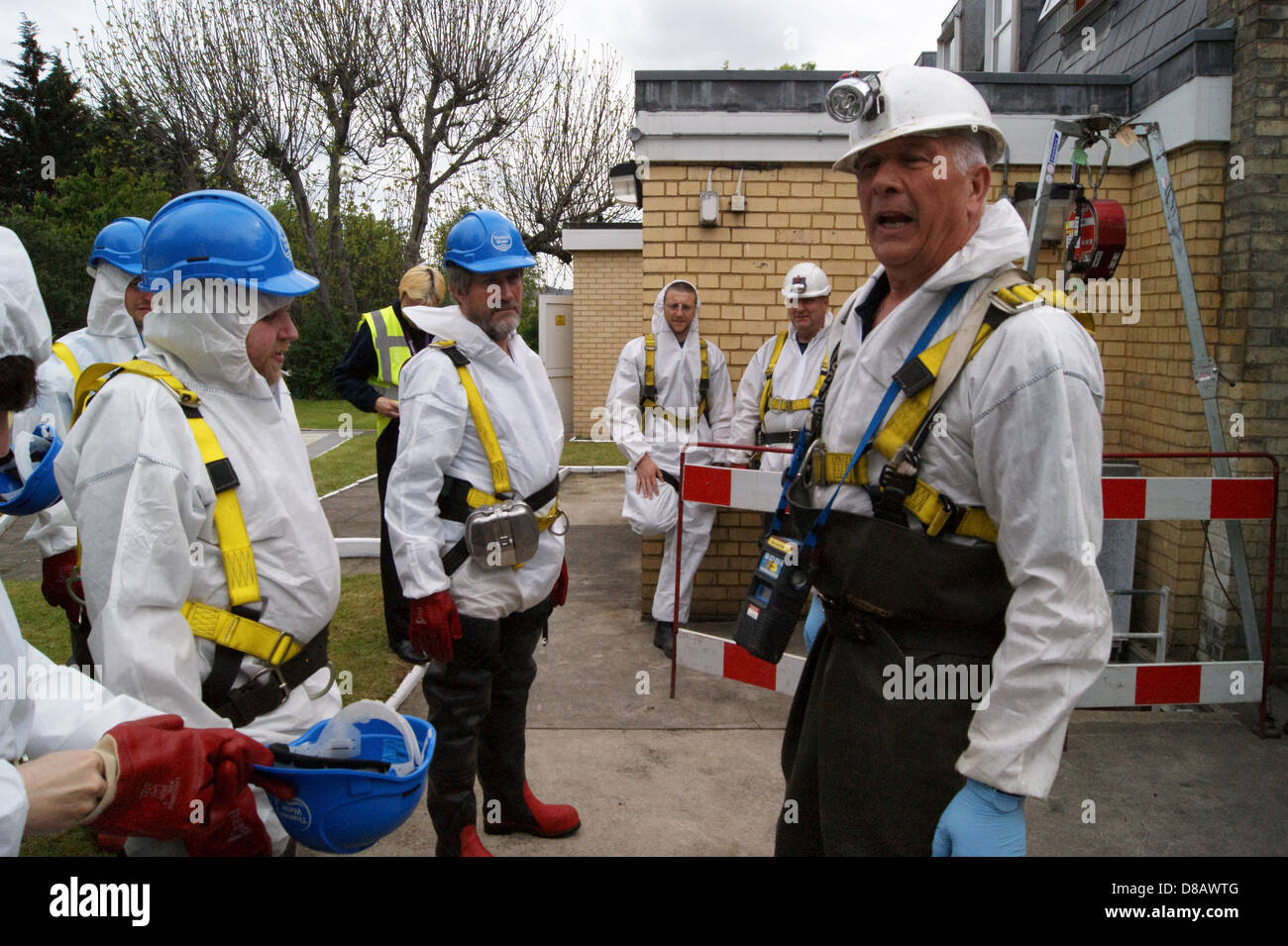 A Thames Water worker gives a safety demonstration before visitors ...