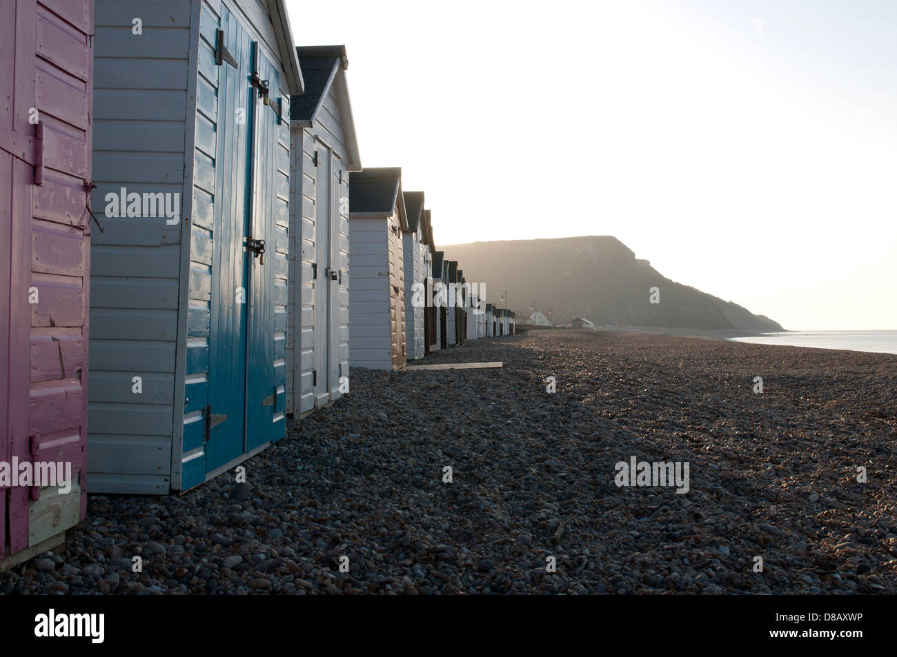 Seaton beach and beach huts at dawn, Devon, England, UK Stock Photo - Alamy