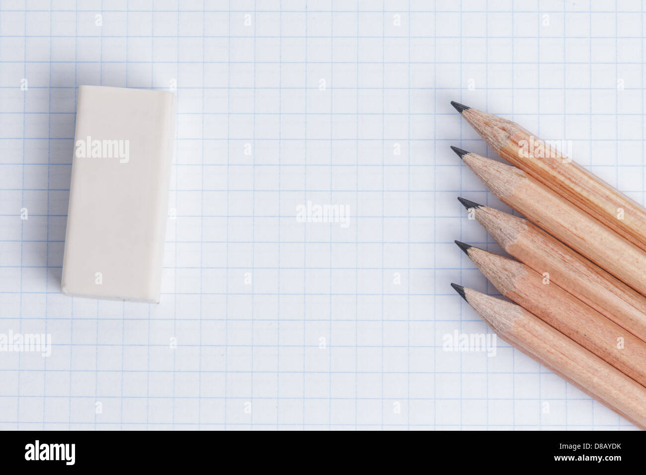 pencils and eraser on notebook page, school or business background ...