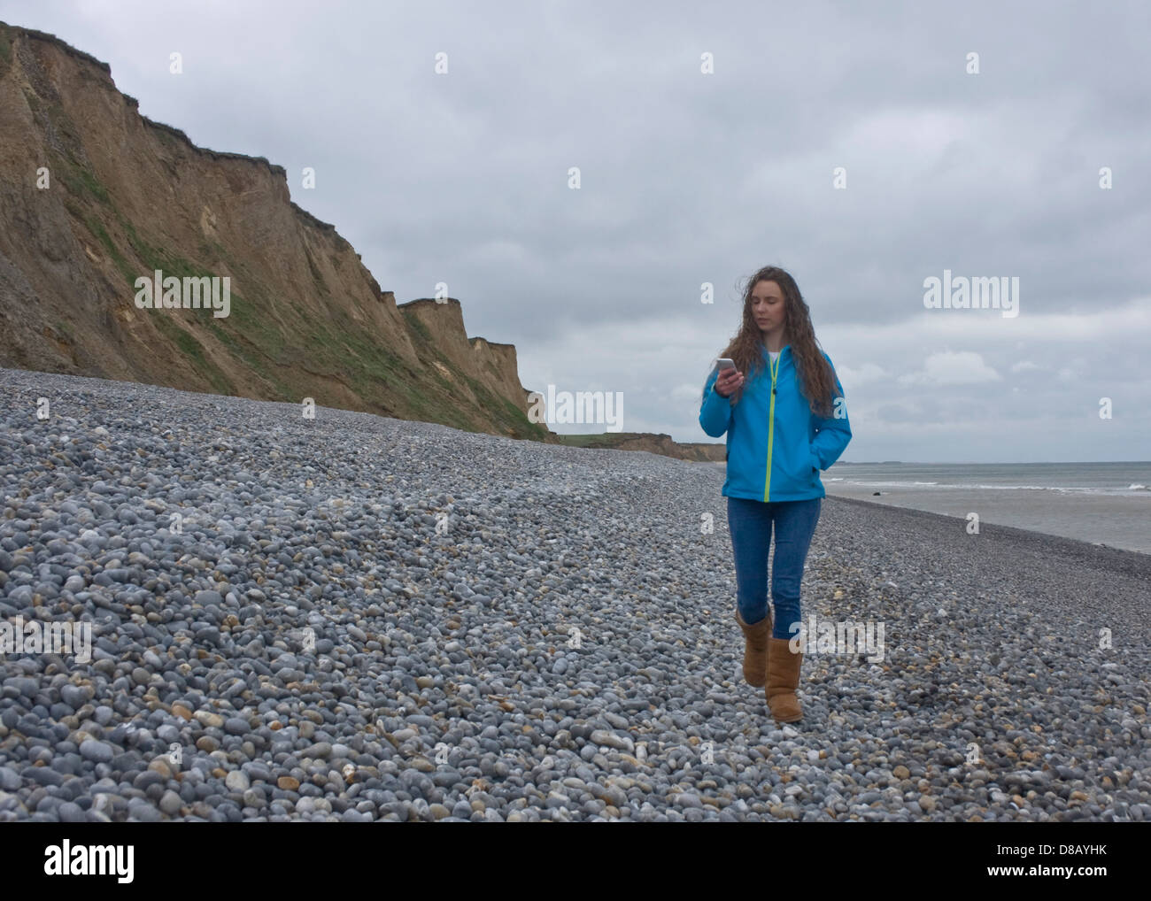 Woman in blue coat using hi-res stock photography and images - Alamy