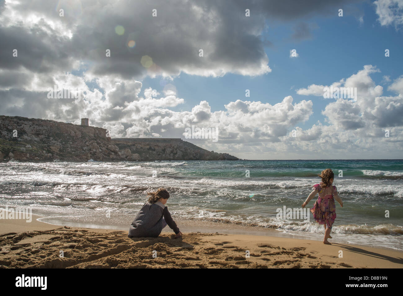 Two children on a beach Malta Stock Photo - Alamy