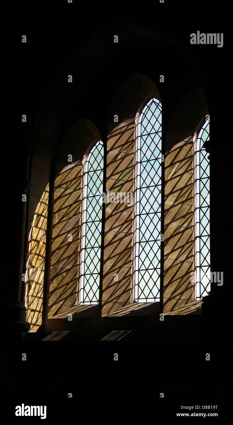Light casting shadows through church window Stock Photo - Alamy