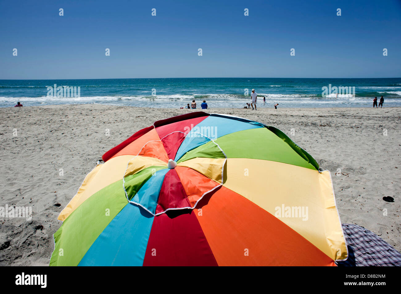 Multicolored parasol on the beach at Carlsbad California Stock Photo ...