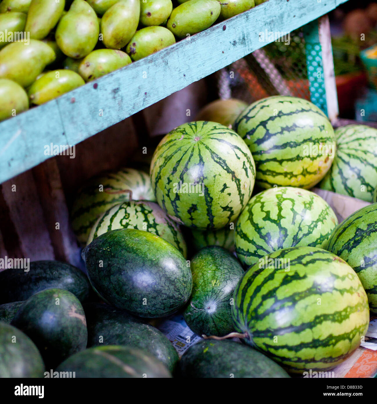Red and yellow watermelon on asian market Stock Photo - Alamy