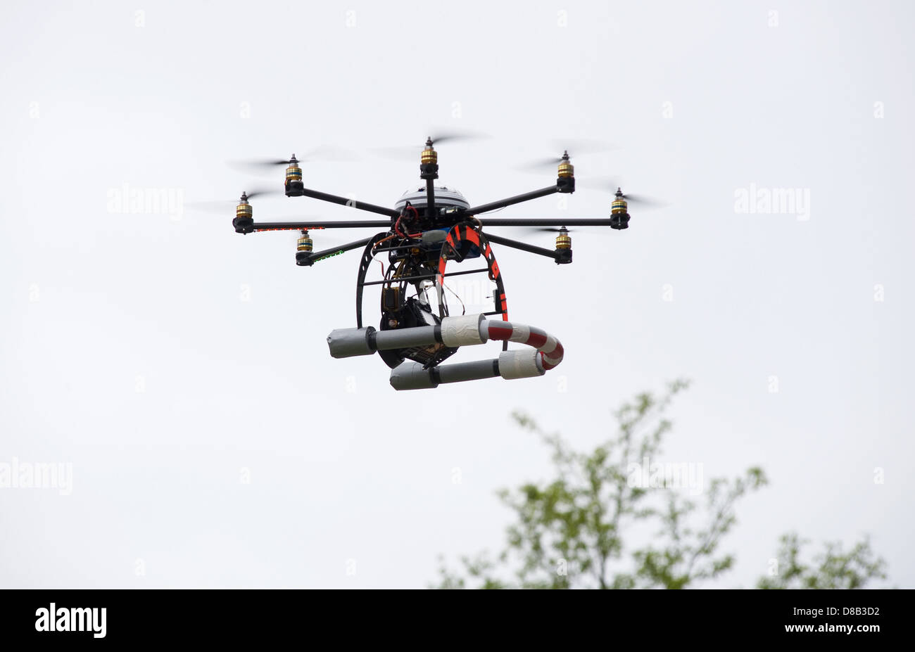 An octocopter with camera flying Stock Photo - Alamy