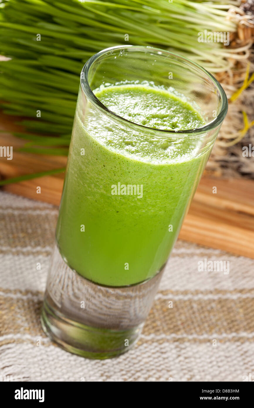 Green Organic Wheat Grass Shot ready to drink Stock Photo - Alamy