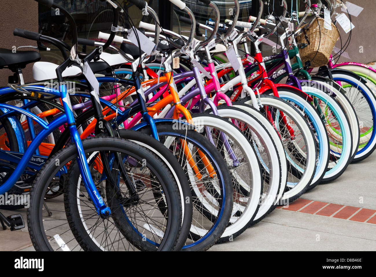 Colorful bicycles lined up for sale on the sidewalk in Los Gatos ...