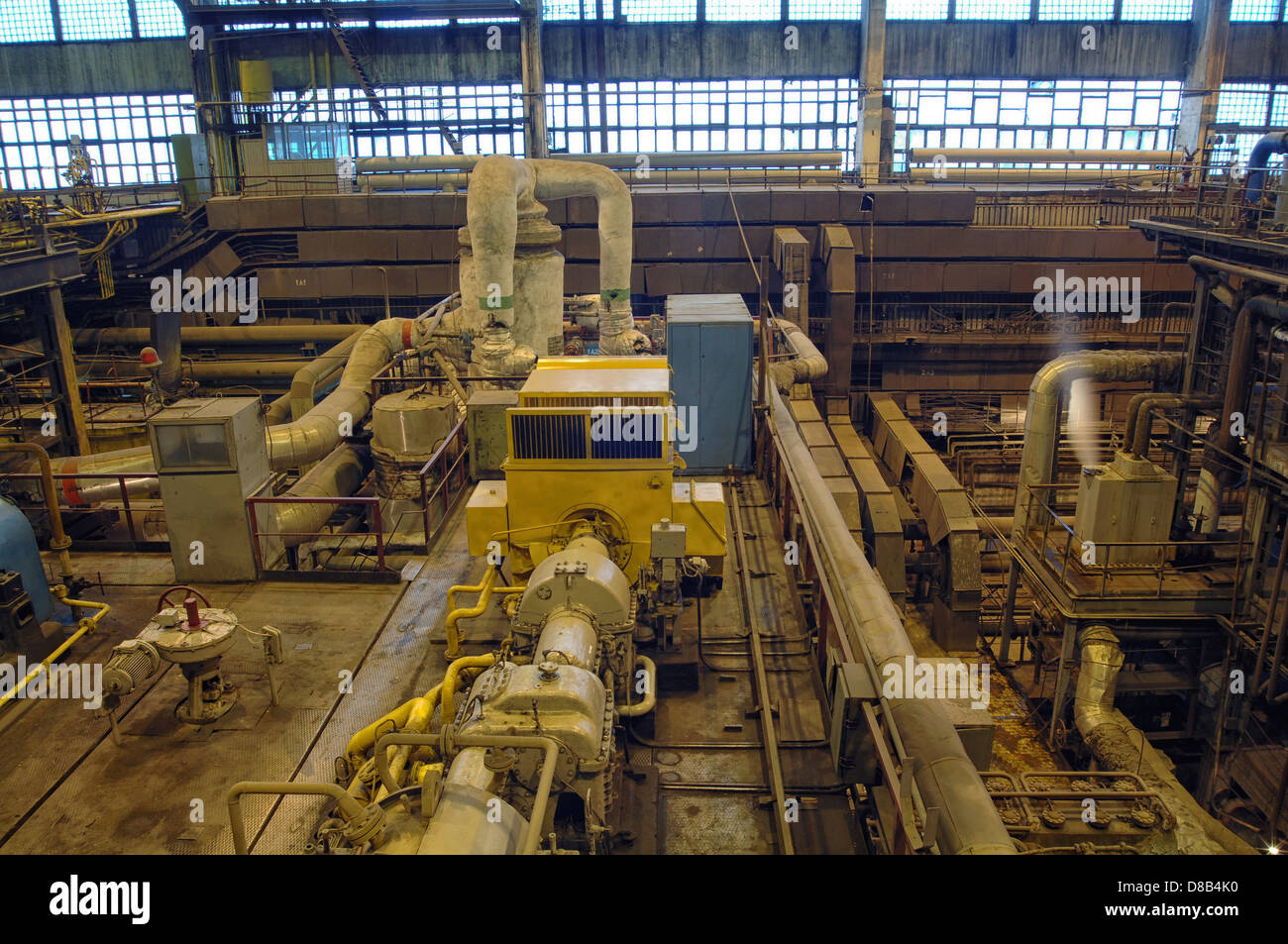Pipes, tubes, machinery and steam turbine at a power plant Stock Photo ...