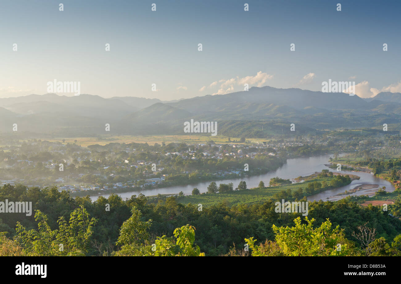 Panorama of green burmese countryside with village at river and ...