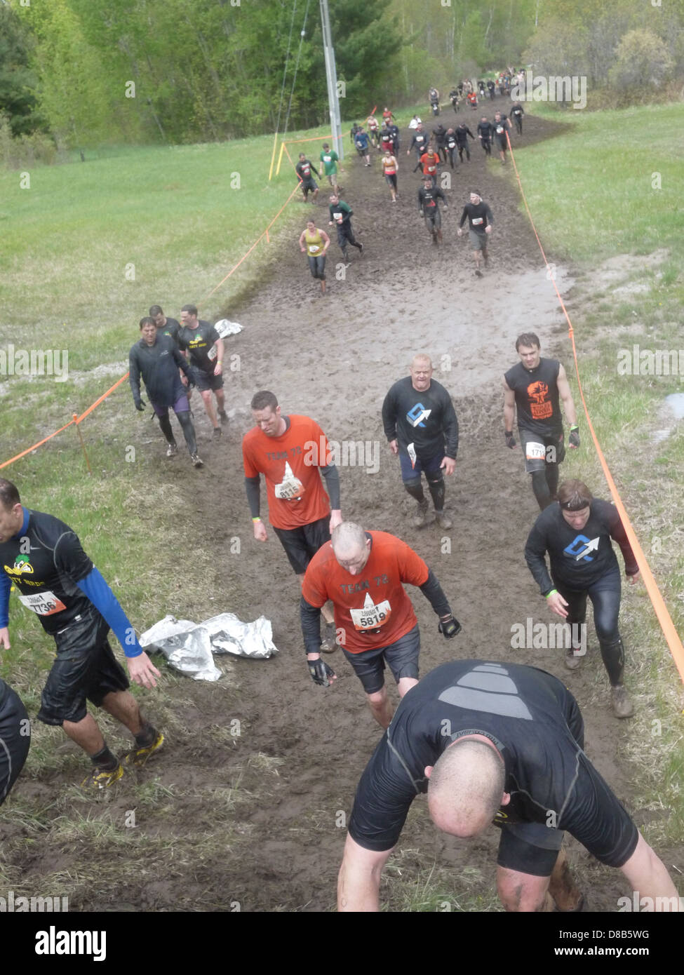 people walking mud road "tough mudder Stock Photo - Alamy