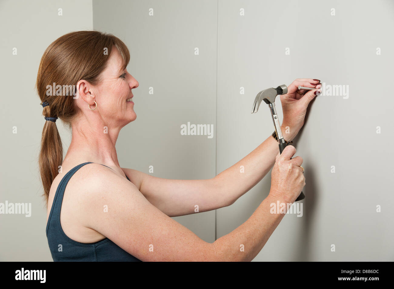 Using a hammer hi-res stock photography and images - Alamy