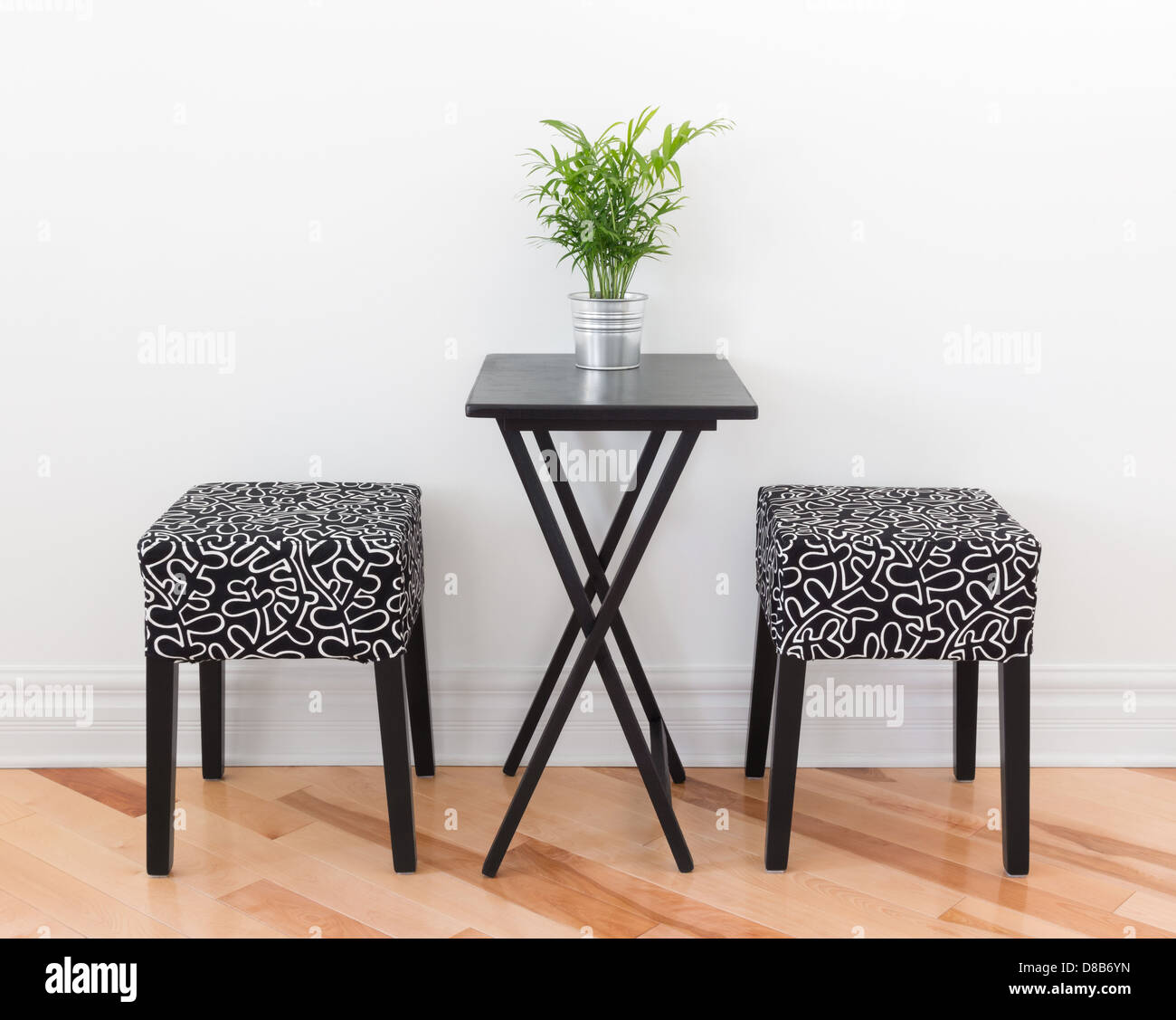 Table for two decorated with green plant. Simple design Stock Photo - Alamy