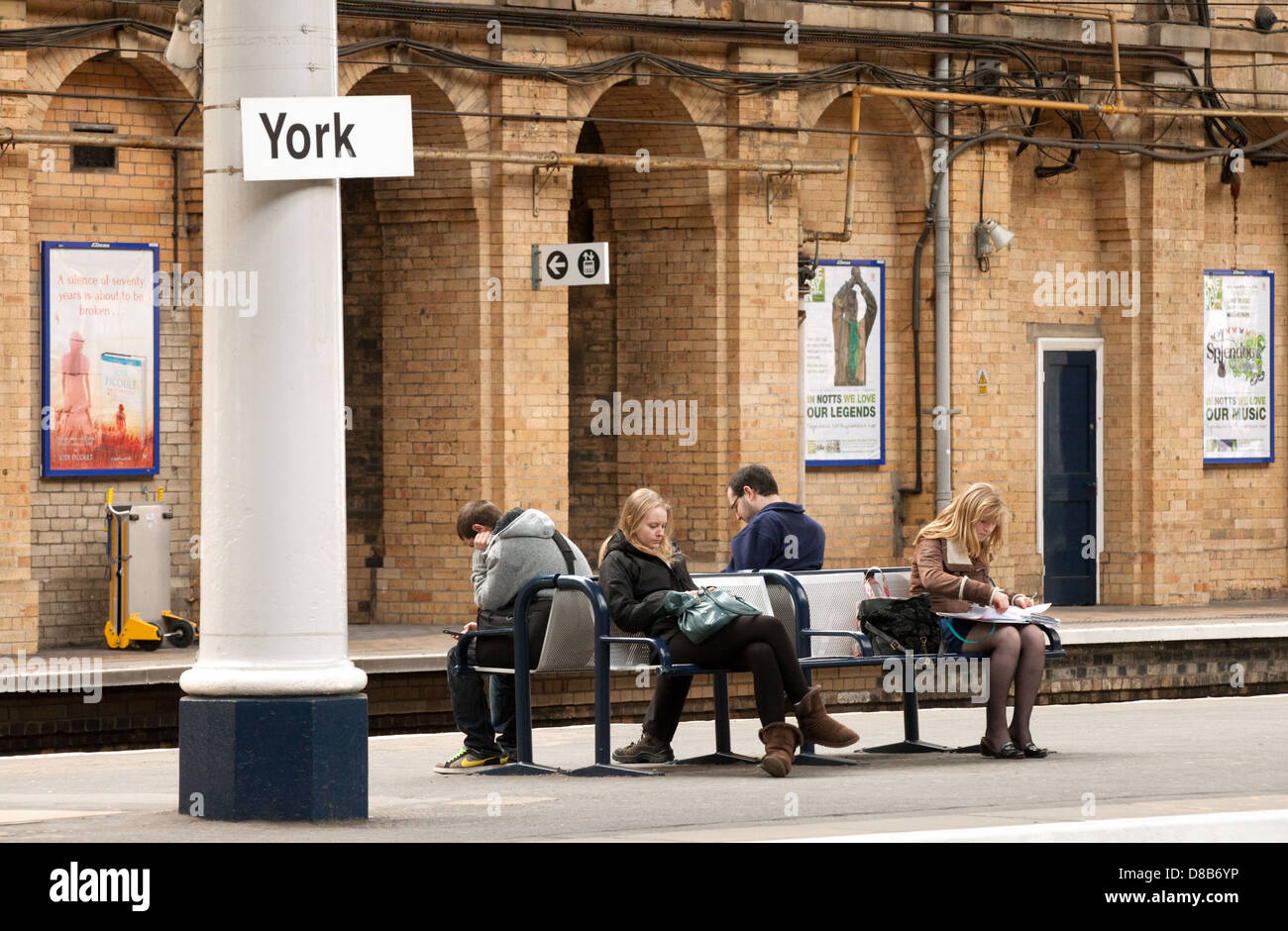 Passengers people waiting for a train on the platform, York railway station, Yorkshire UK Stock ...