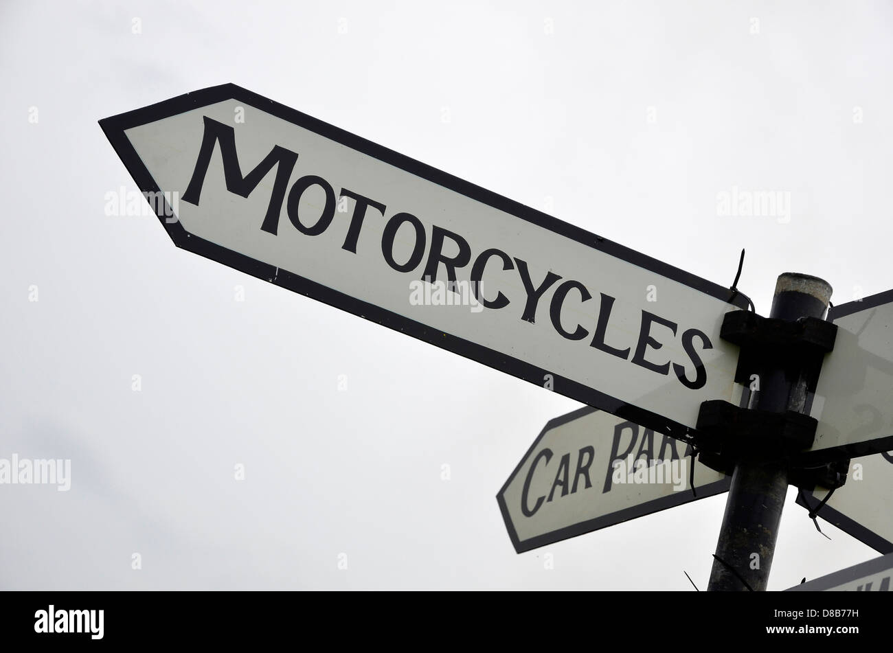 Motorcycles sign pointing to a display area Stock Photo - Alamy