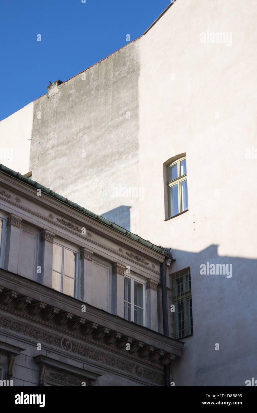 A Building casting shadows on neighbouring property in the evening sun ...