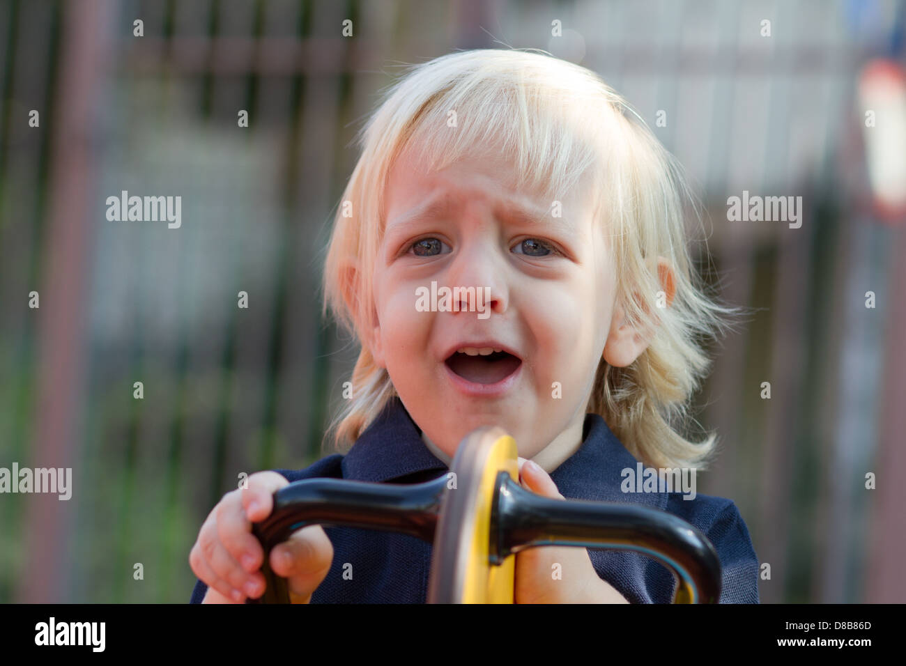 Little baby boy crying out loud alone on the playground Stock Photo - Alamy