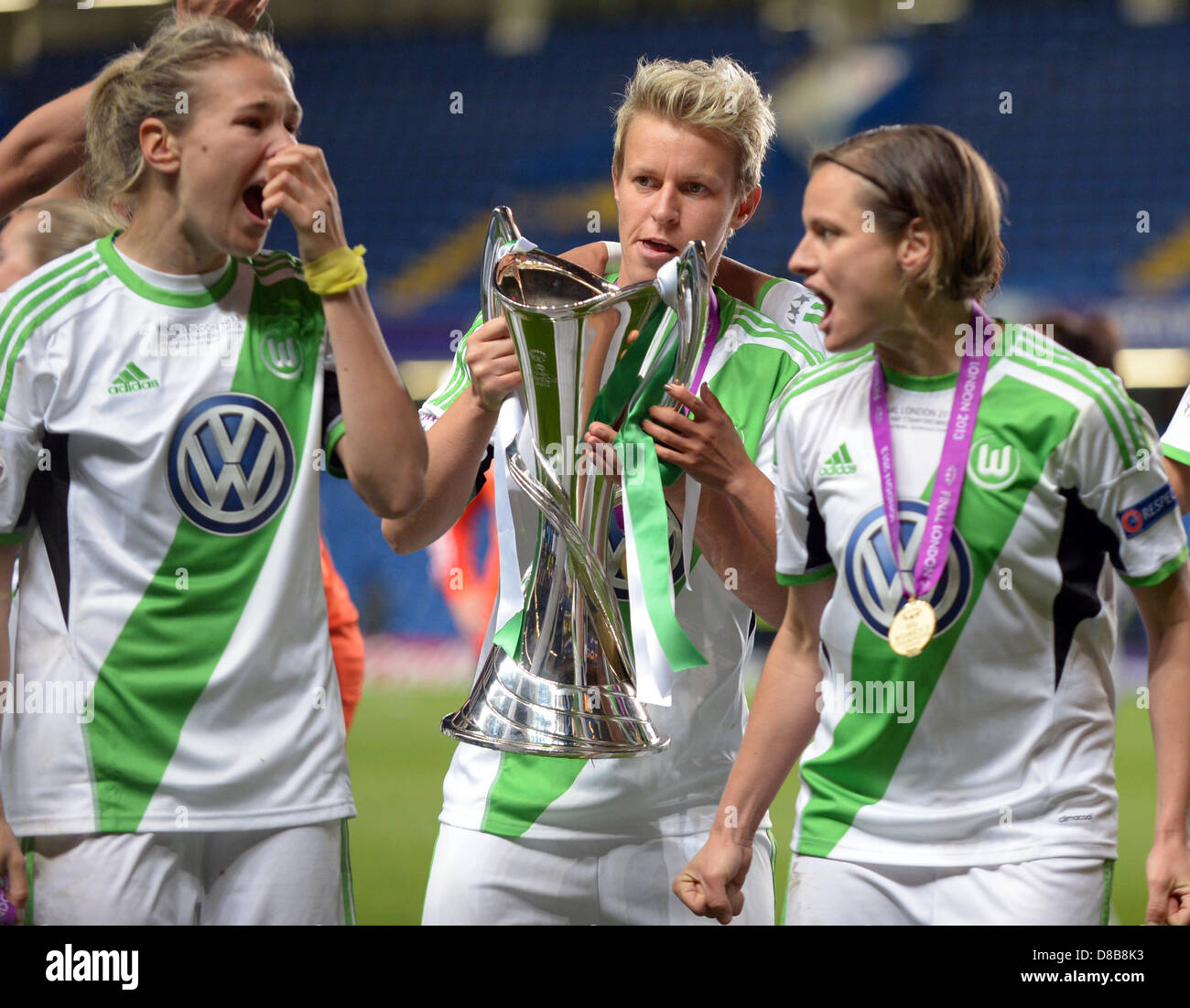 Wolfsburg's Ivonne Hartmann (C) and Martina Mueller (R) celebrate with ...