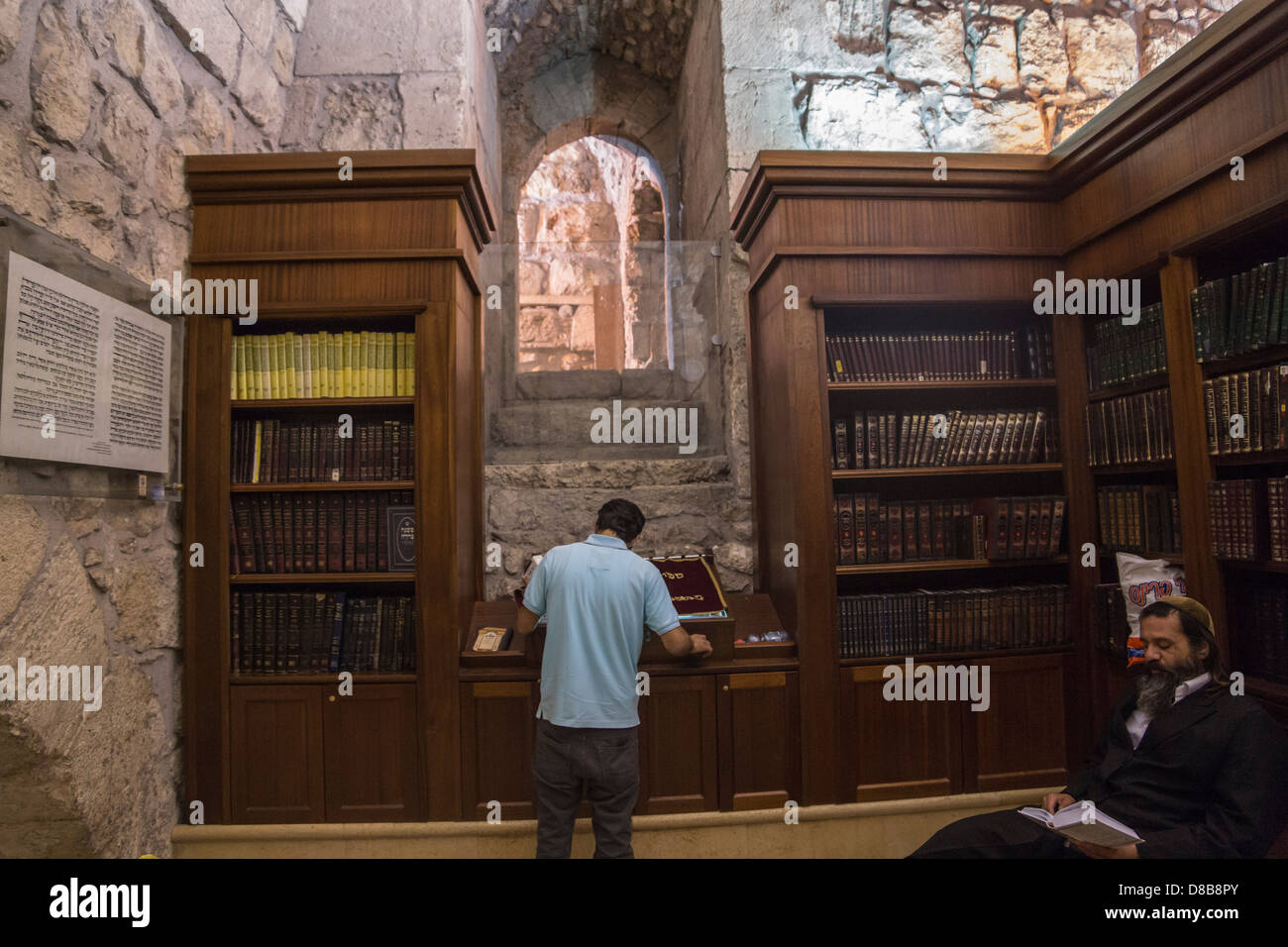 Israel. A man prays while another learns the holy scripture (the Torah ...