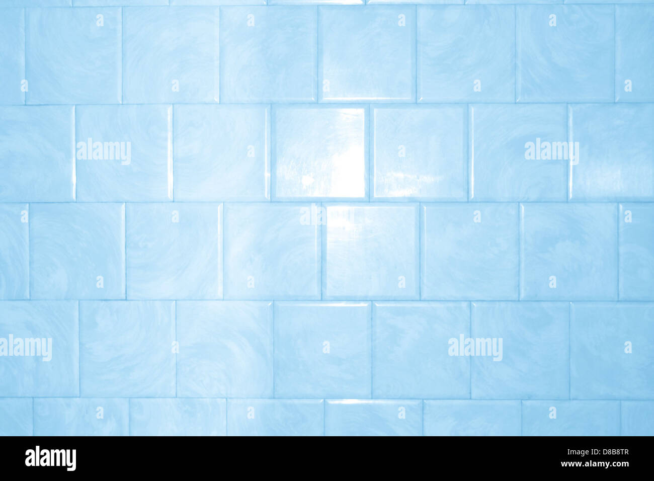 A close-up of baby blue bathroom tiles featuring a swirl pattern ...