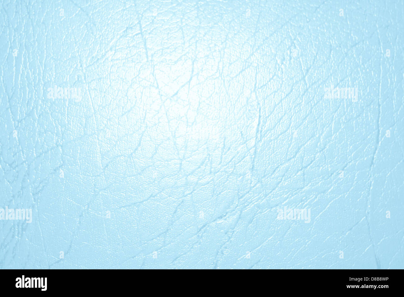 A close-up of soft, baby blue leather shows its smooth texture and ...