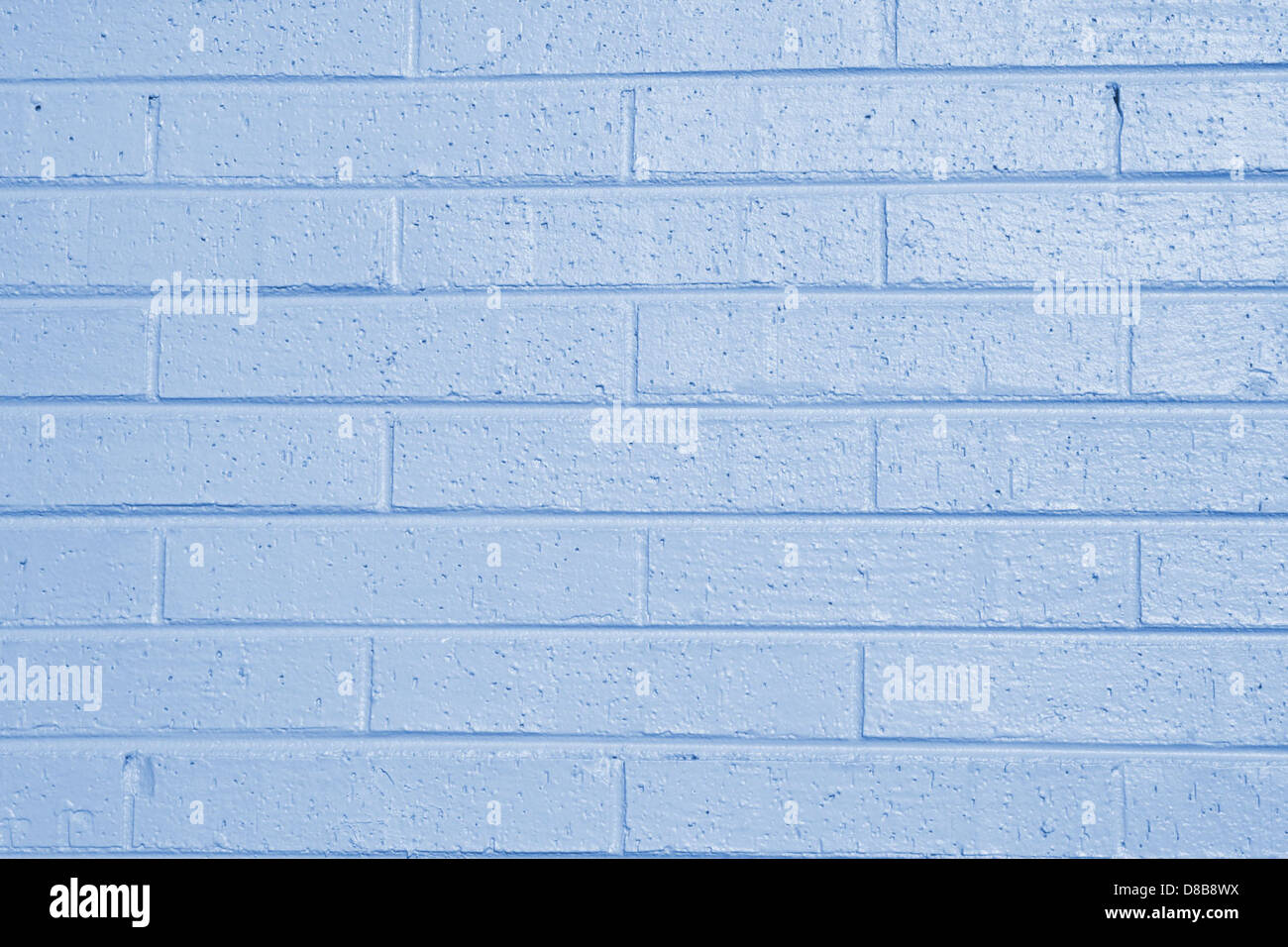 A close-up of a painted baby blue brick wall texture, featuring even ...
