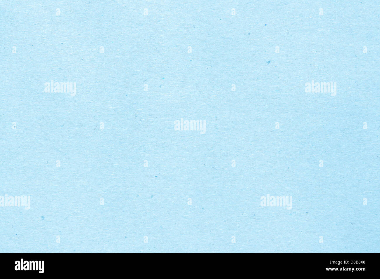 This image features a light baby blue paper texture with flecks ...