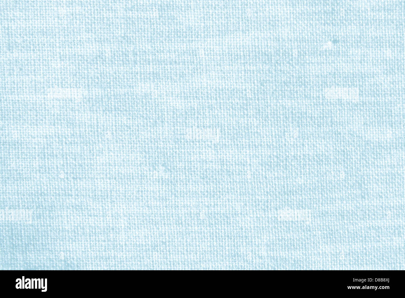 A close-up shot of baby blue woven fabric. The texture of the fabric is ...