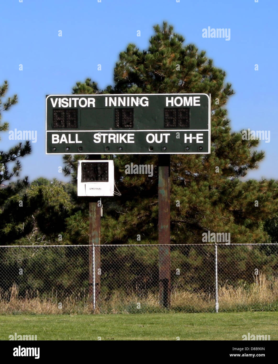 A baseball scoreboard displays game scores and statistics. The board is ...