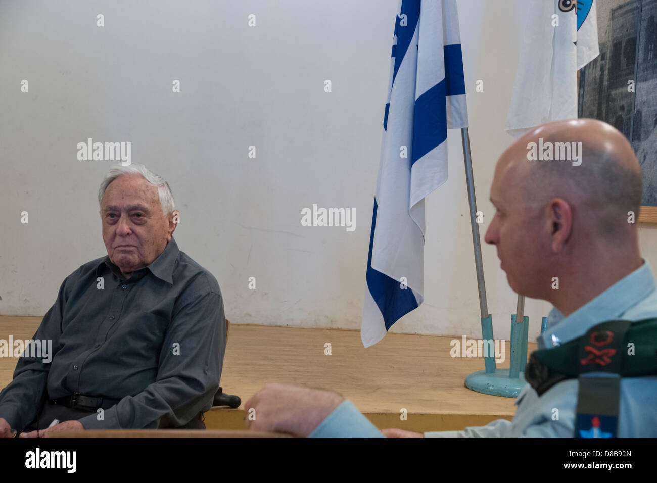 A Israeli general listens to General Itzhak Pundak (seated), at age 100 ...