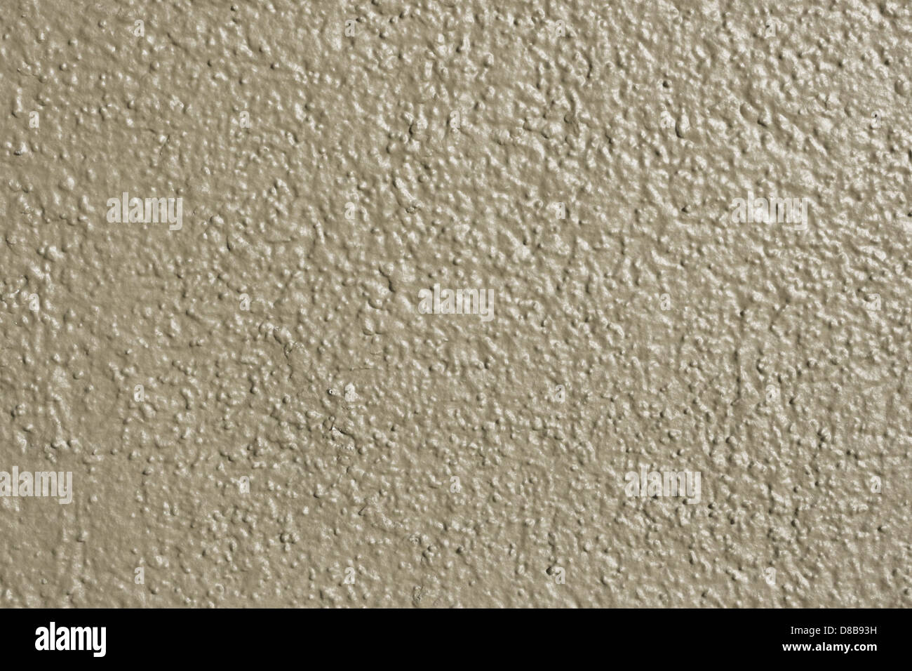 A smooth beige painted wall texture, offering a neutral and soft color ...