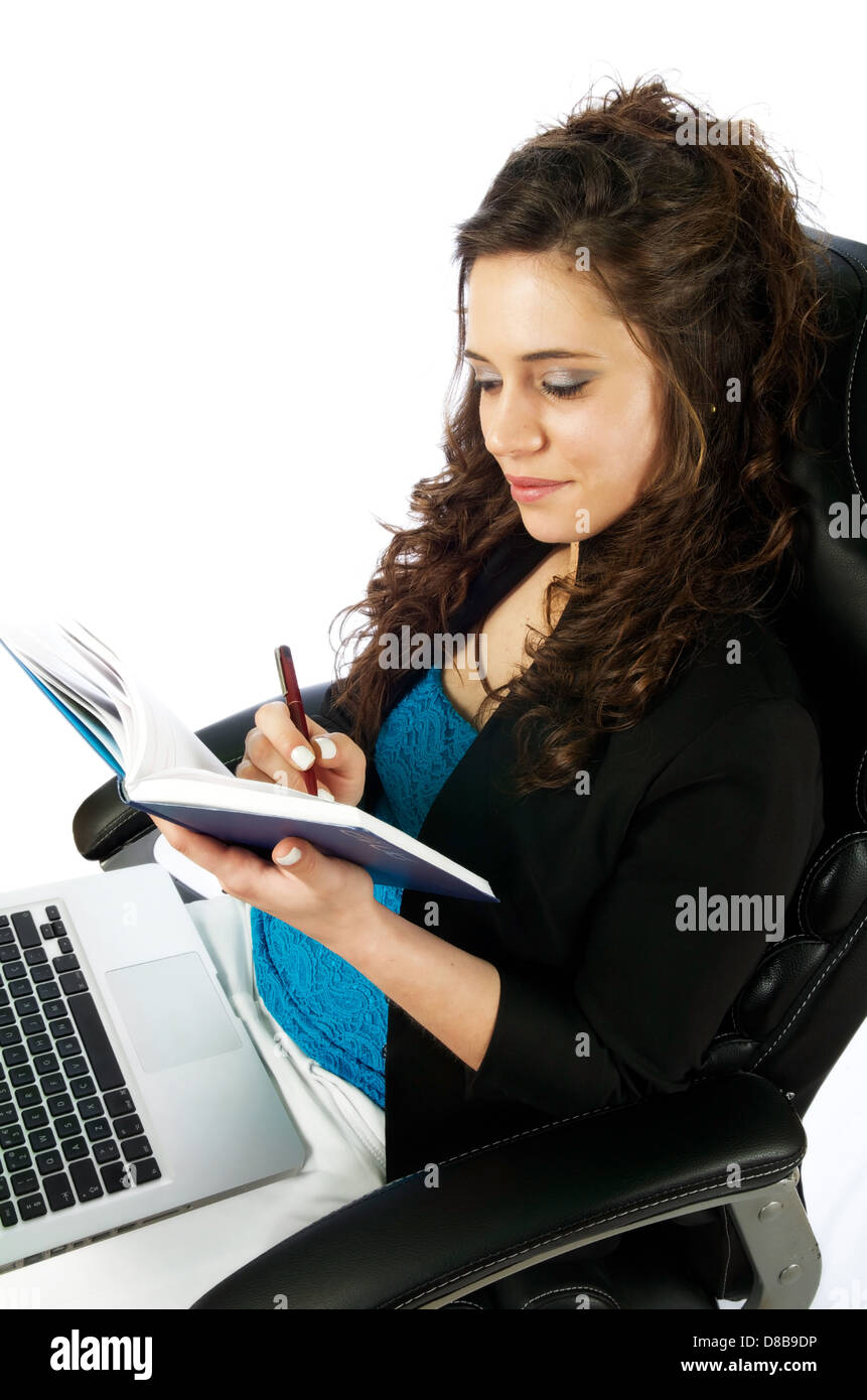 Attractive woman writing appointments in her schedule Stock Photo - Alamy