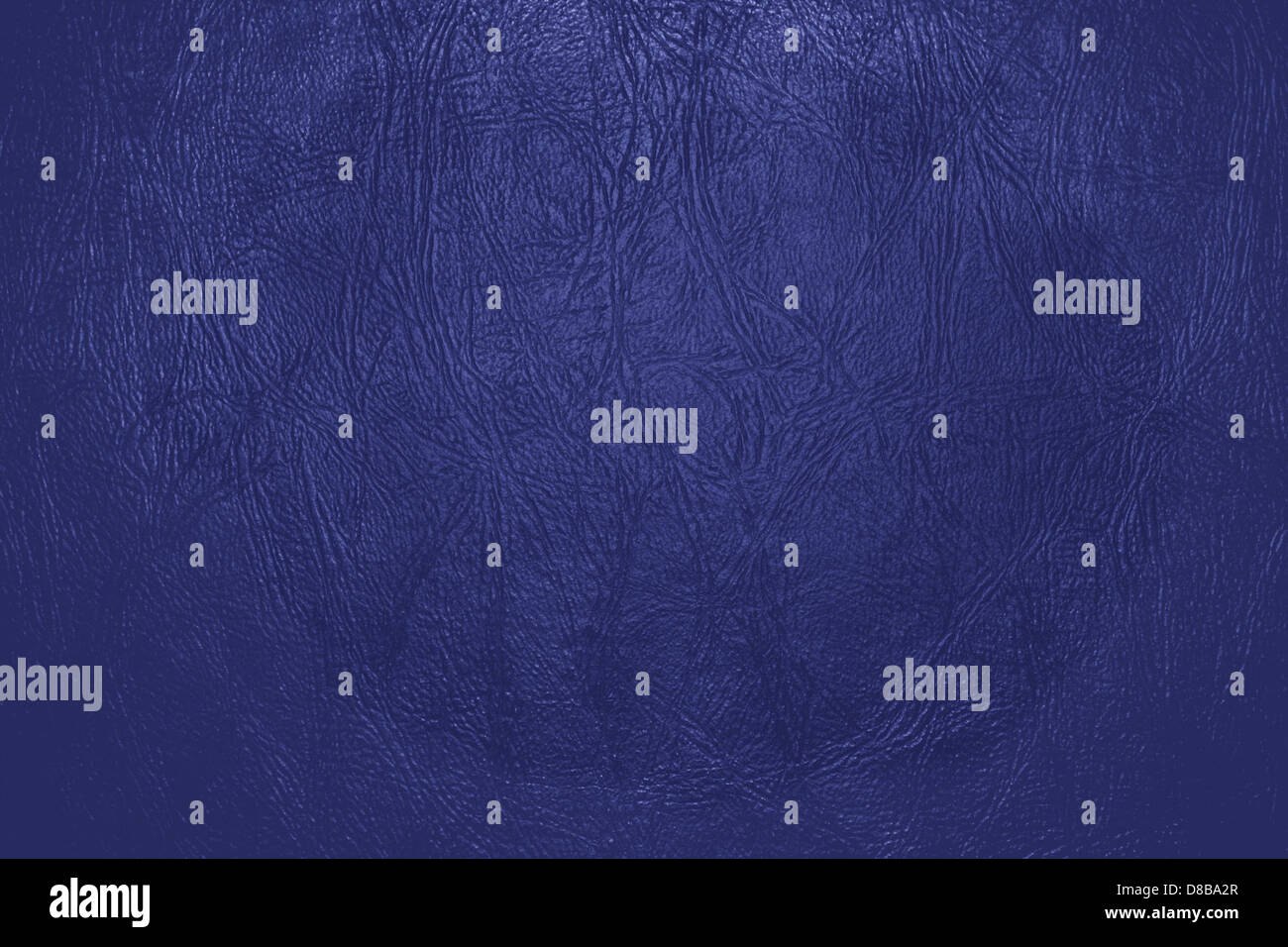 A close-up of blue leather texture, highlighting its smooth, luxurious ...