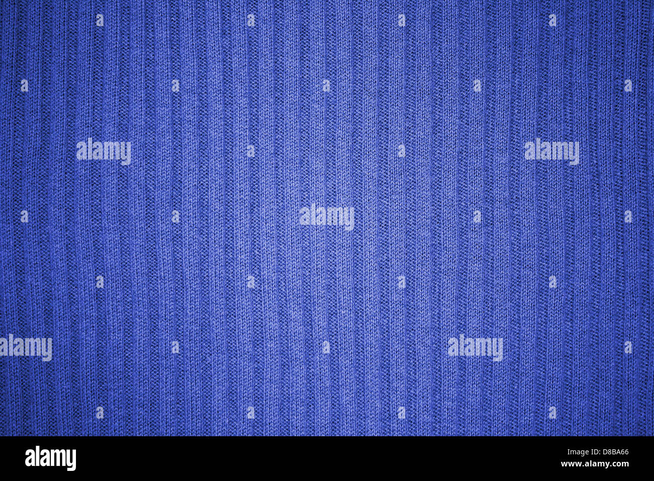 A close-up view of a blue ribbed knit fabric texture, showcasing the ...