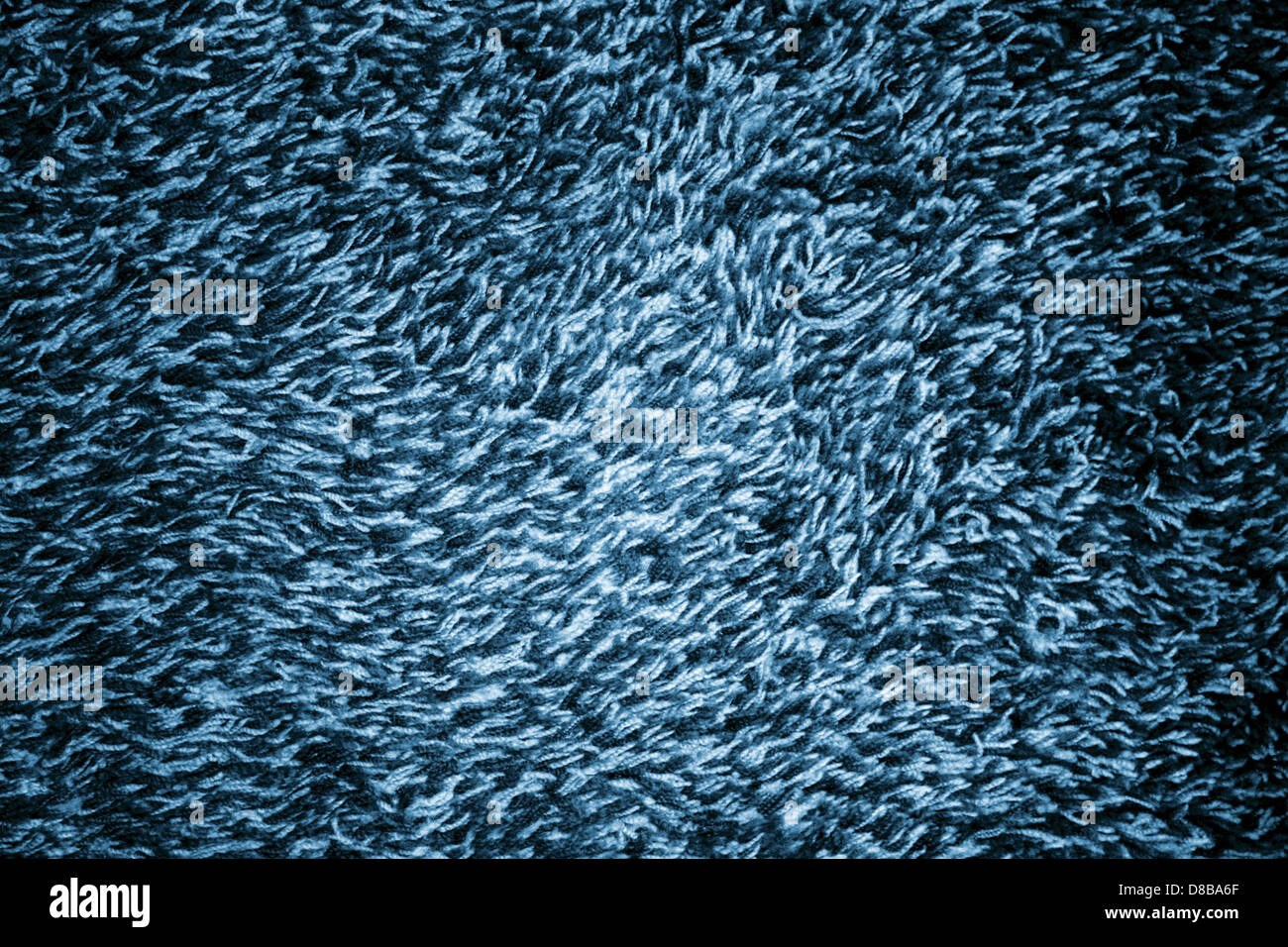A close-up image of blue shag carpeting, showcasing its thick, plush ...