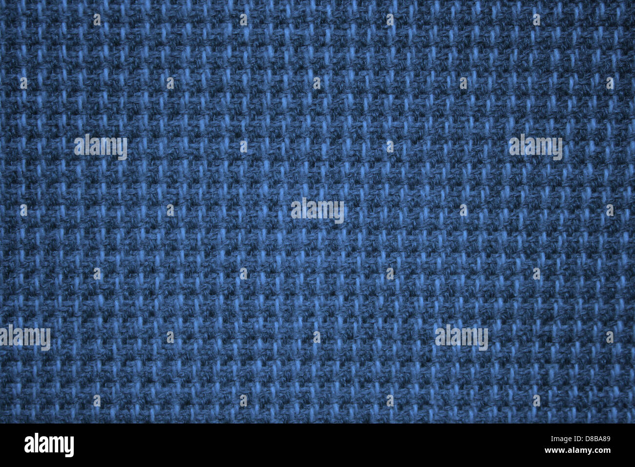 A close-up of blue upholstery fabric, showcasing the texture and weave ...
