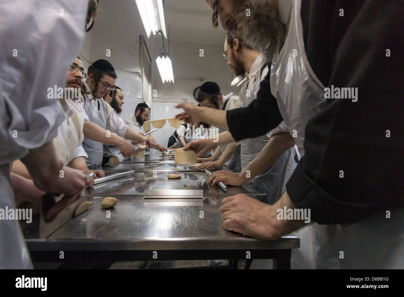 Jerusalem, Israel. Ultra-Orthodox ("Haredi") men preparing dough at a ...