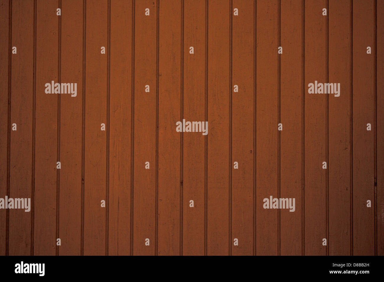 A detailed image of brown vertical siding, showing the smooth texture ...