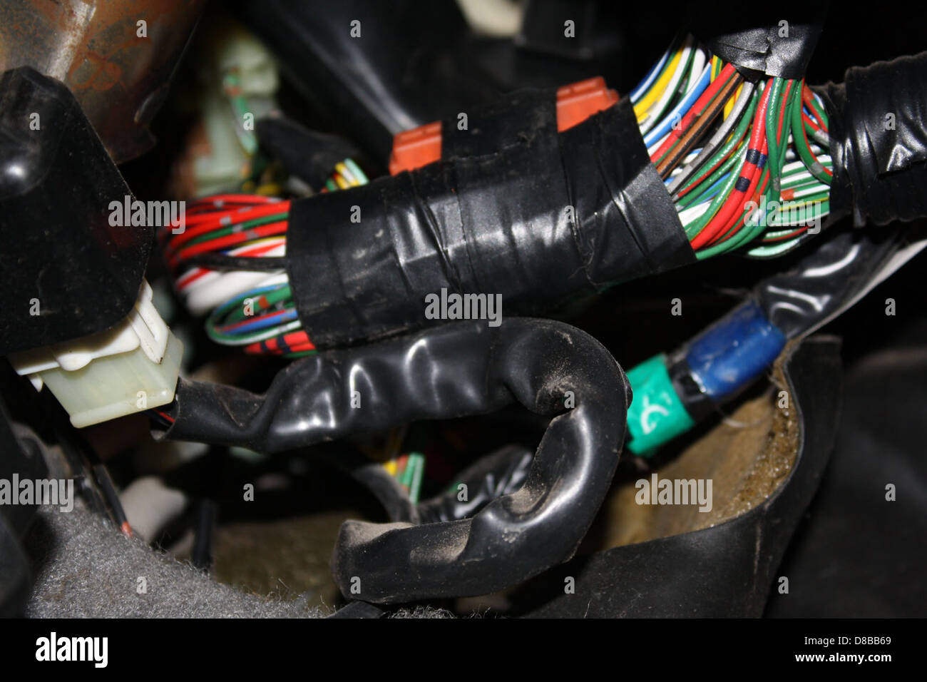 A bundle of wires neatly coiled together, displaying various colored ...