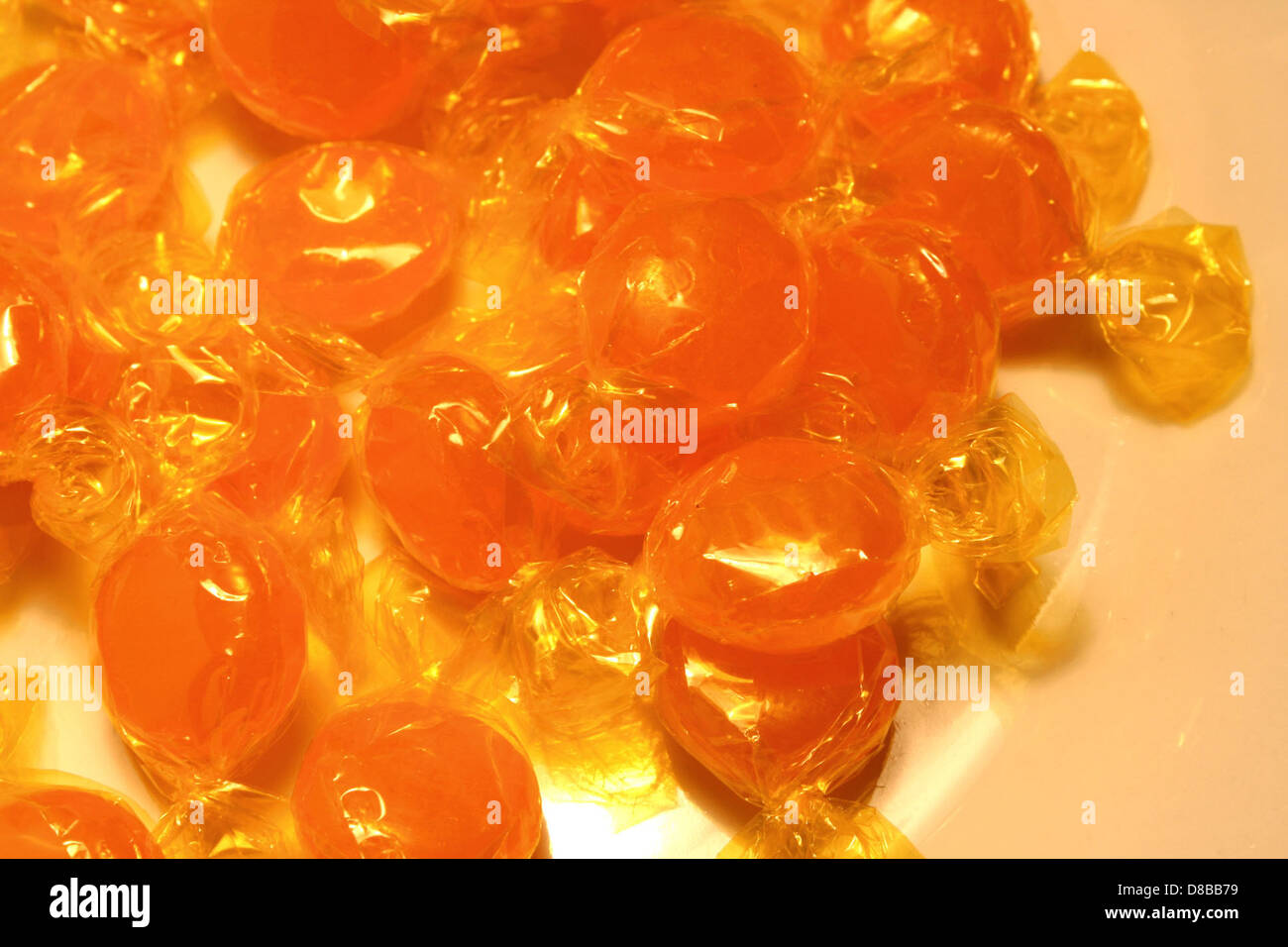 A collection of butterscotch candies, characterized by their smooth ...