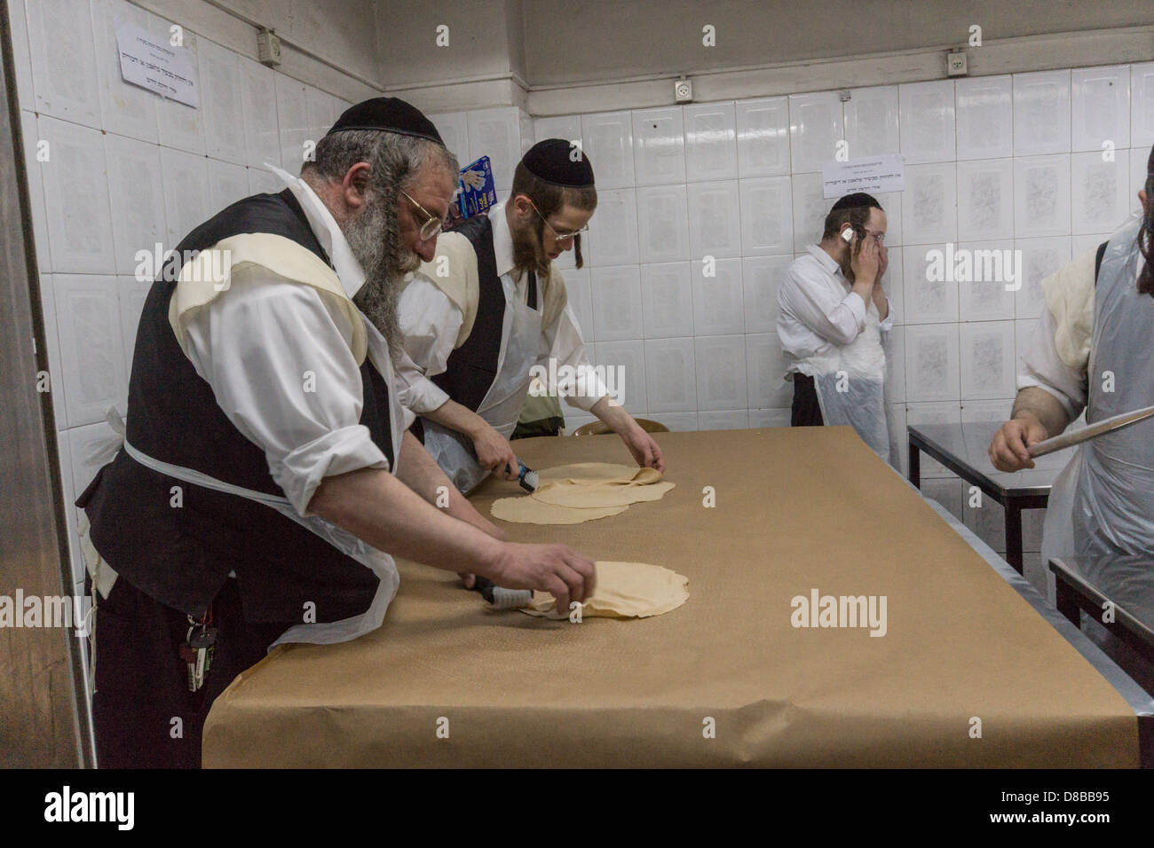 Jerusalem, Israel. Ultra-Orthodox ("Haredi") men working at a Maztoh ...