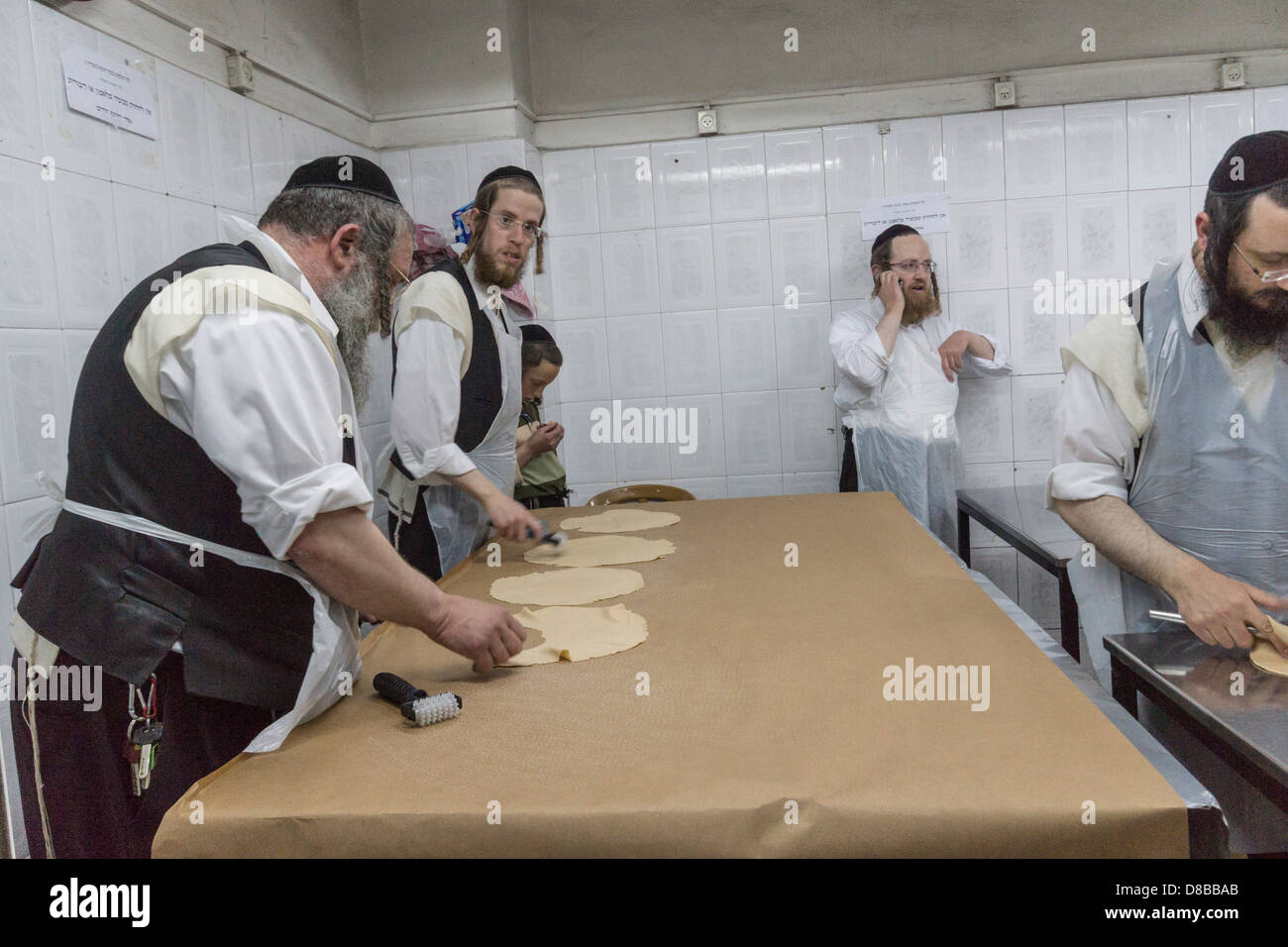 Jerusalem, Israel. Ultra-Orthodox ("Haredi") men working at a Maztoh ...