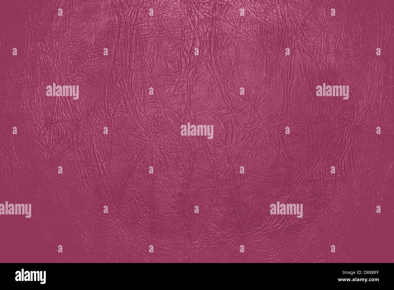 A close-up of cherry red leather, showing its smooth texture and rich ...