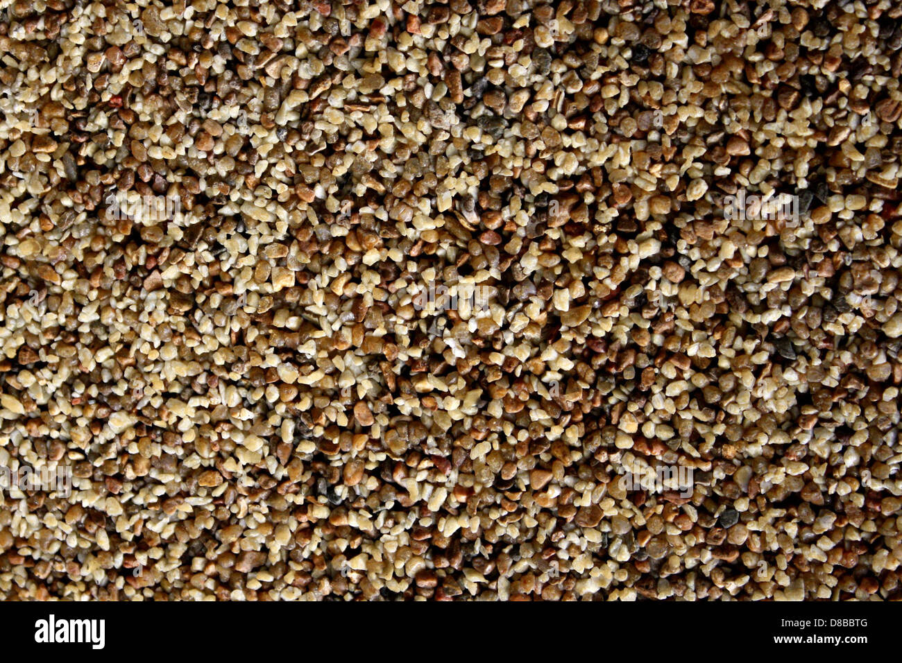 An image showing the coarse texture of sand and gravel, often used in ...
