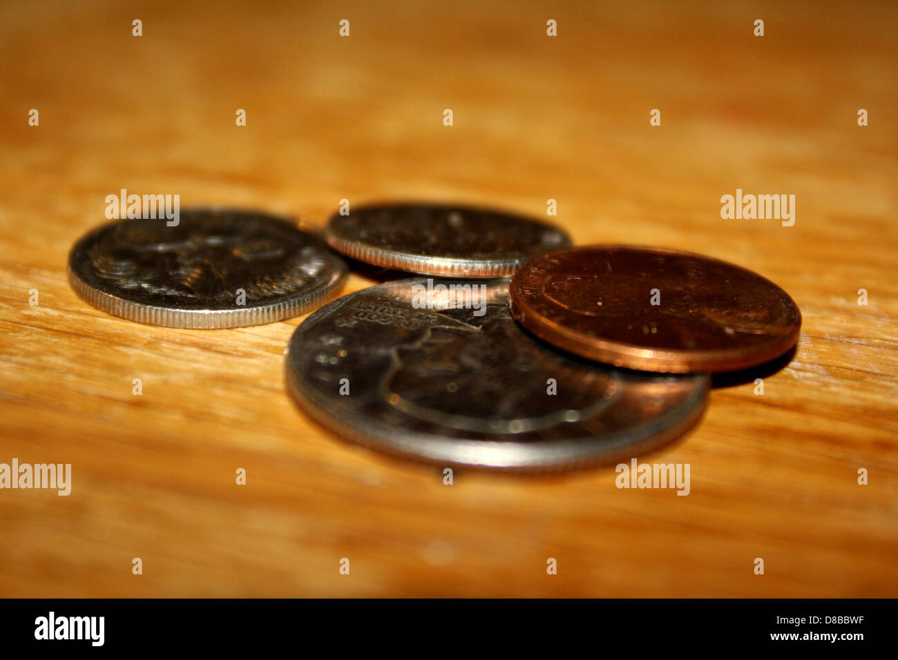 A side view of several coins stacked on top of each other, showcasing ...