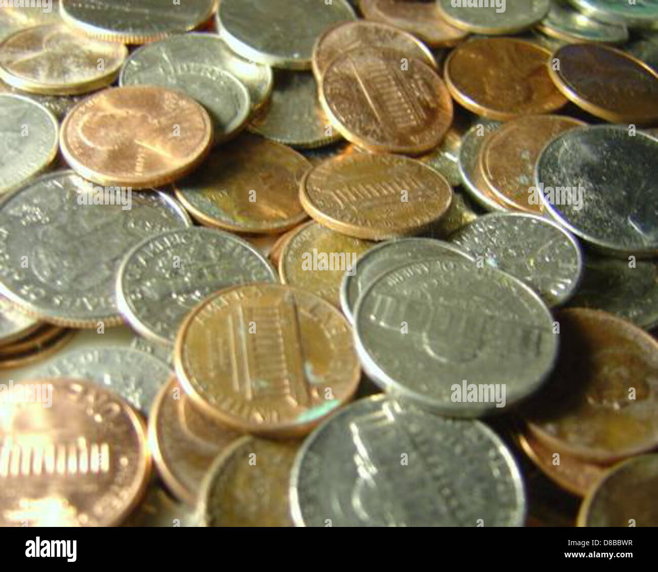 A collection of coins, showing various denominations and metals. Coins ...