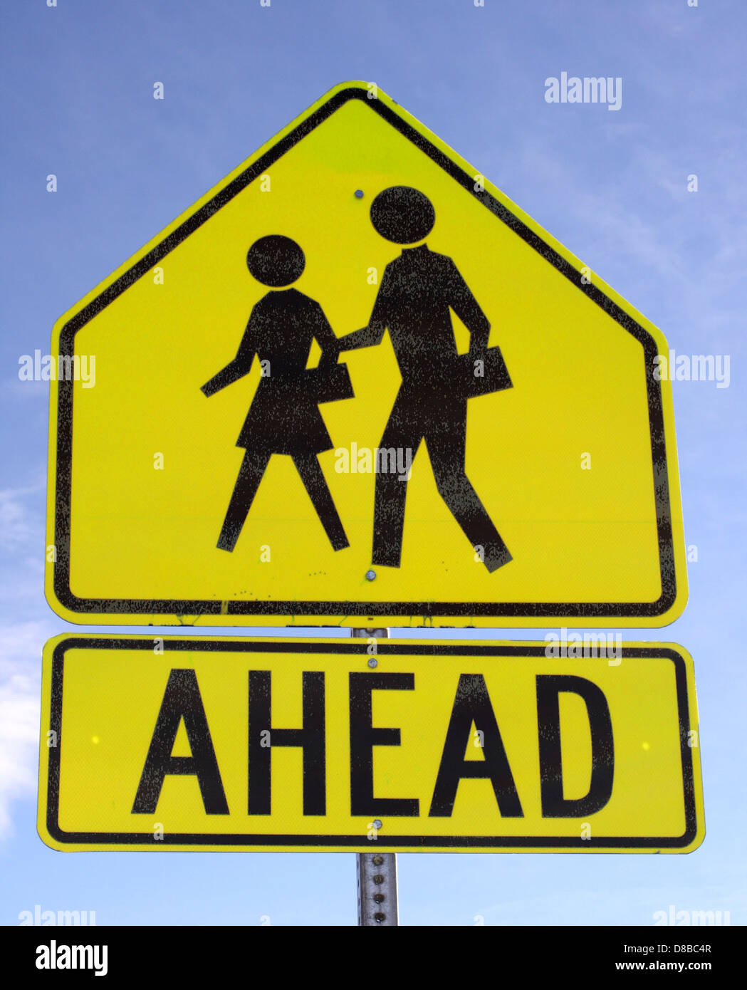 This stock photo shows a standard crosswalk ahead traffic sign. The ...