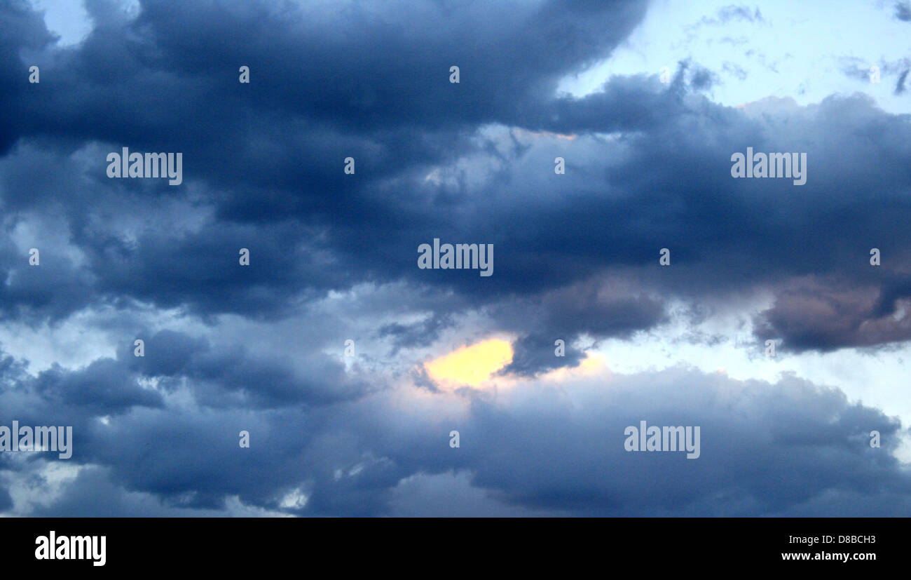 This image depicts a sky filled with dark clouds, suggesting impending ...