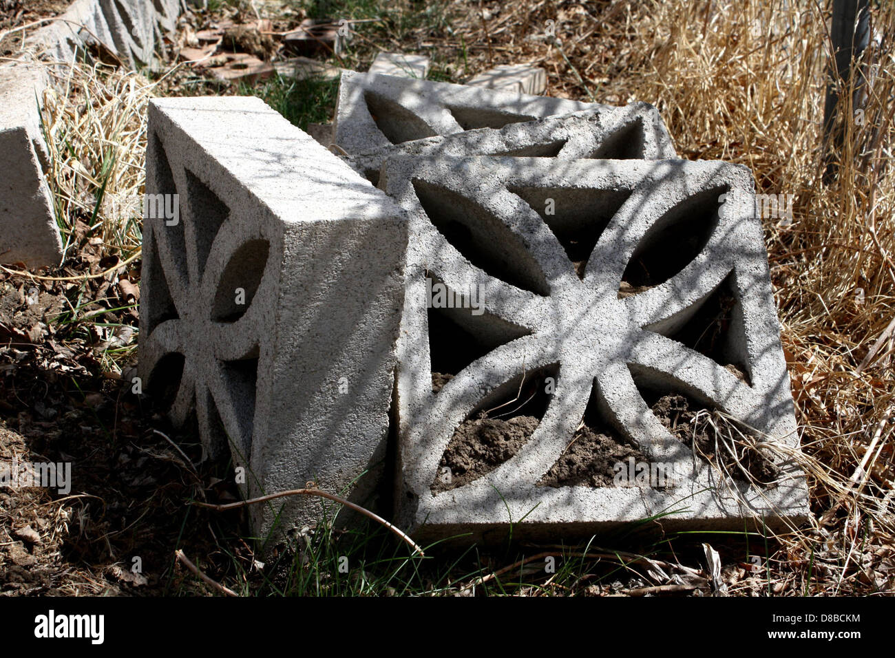 A stack of decorative cinder blocks arranged in a garden, often used ...