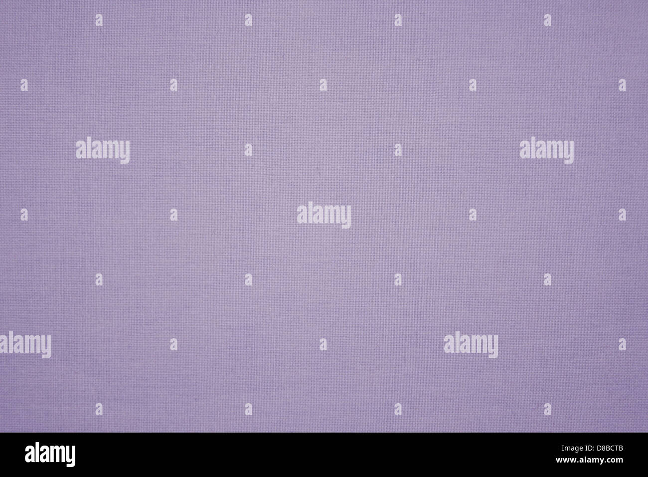 A close-up of dusty purple canvas fabric, highlighting its texture and ...